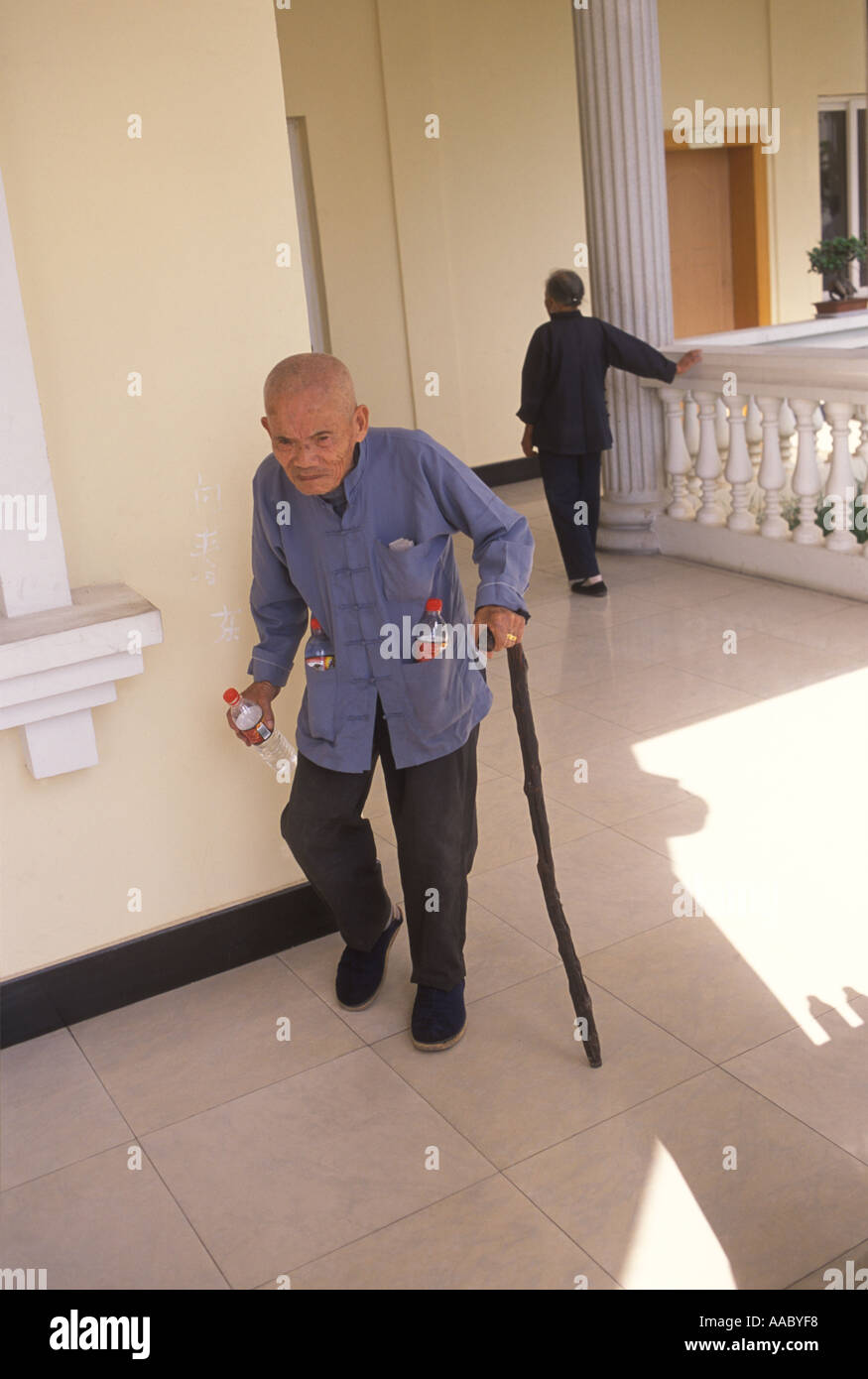 Old chinese man walking stick hi-res stock photography and images - Alamy
