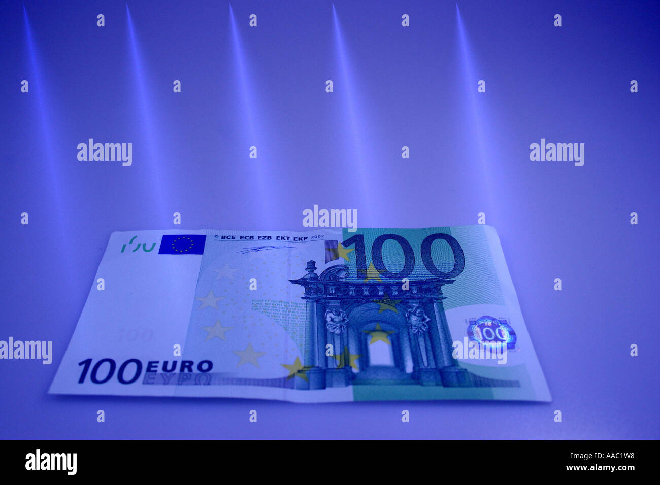 Euro banknote in spotlight Stock Photo - Alamy
