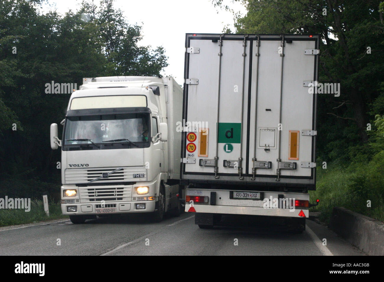 Semi truck and two cars on the road hi-res stock photography and images ...