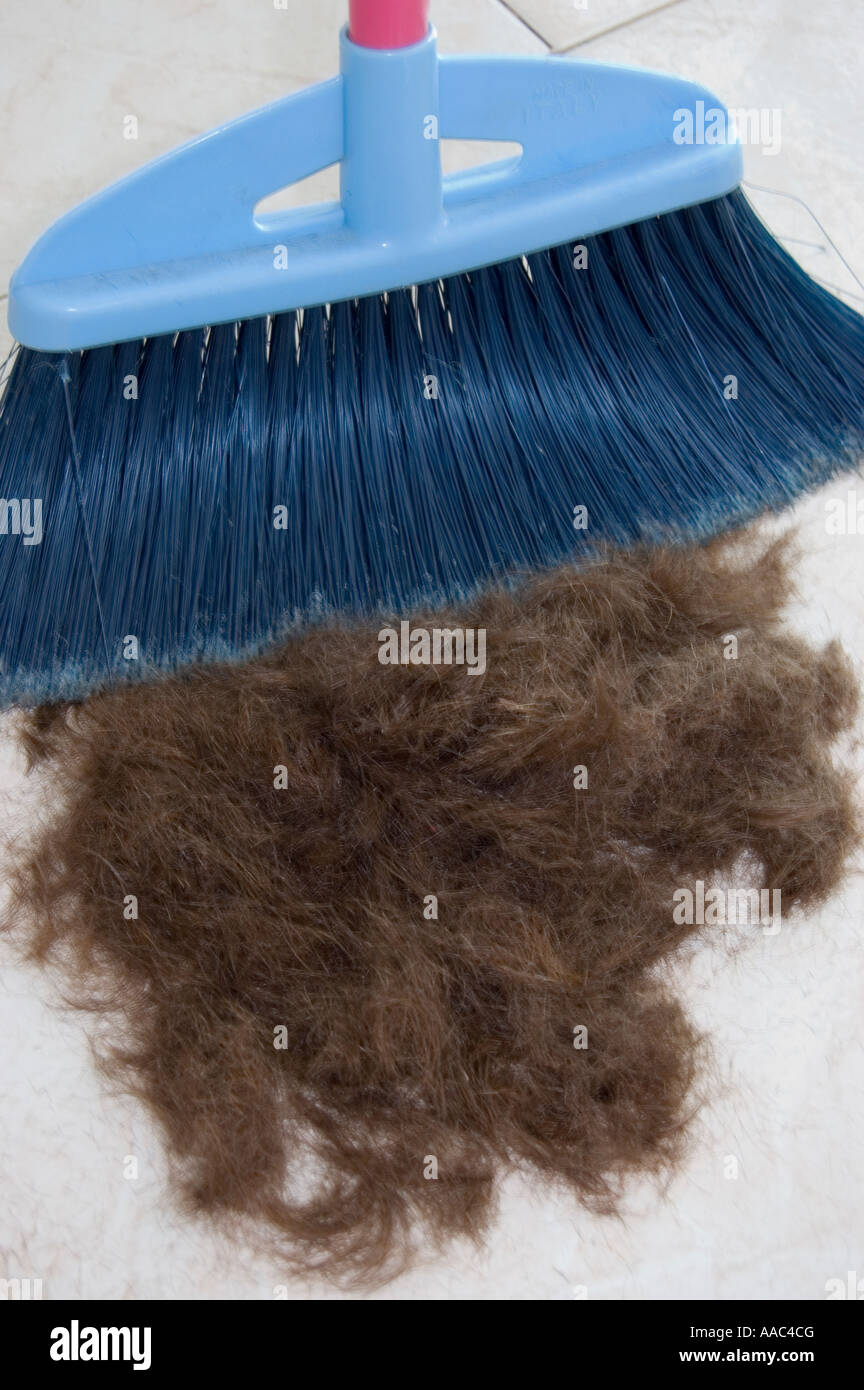 sweeping with a broom hairs on floor Stock Photo - Alamy