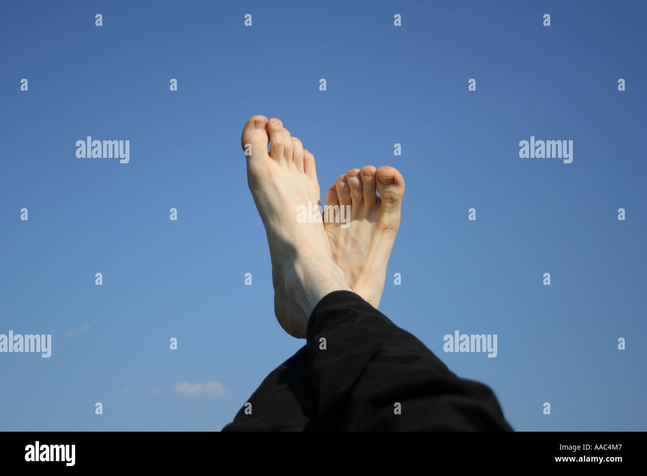 Feet with sky Stock Photo - Alamy