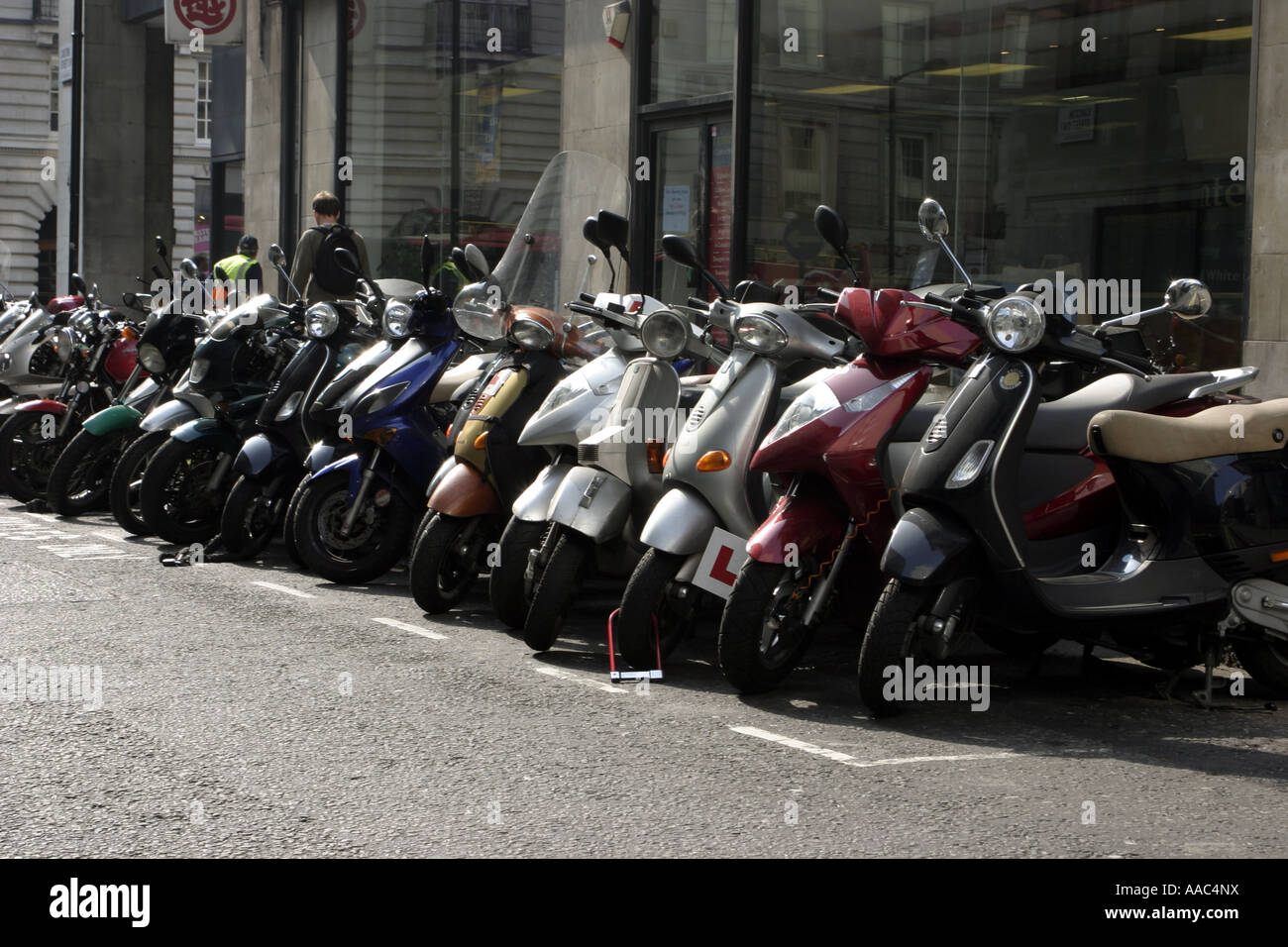 Row of scooters in london Stock Photo - Alamy