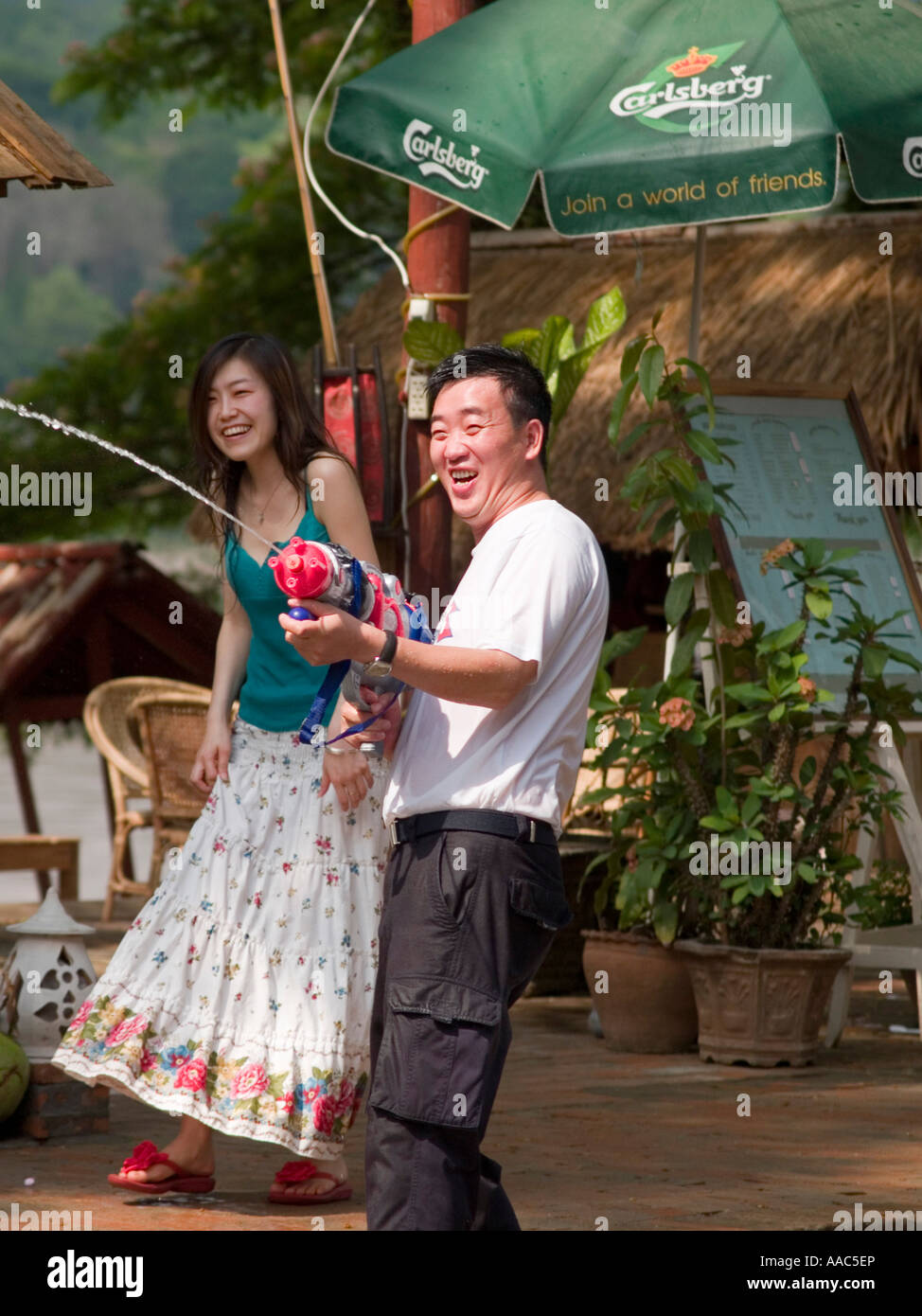 enjoying Songkran the Southeast Asian New Year and water festival Luang ...