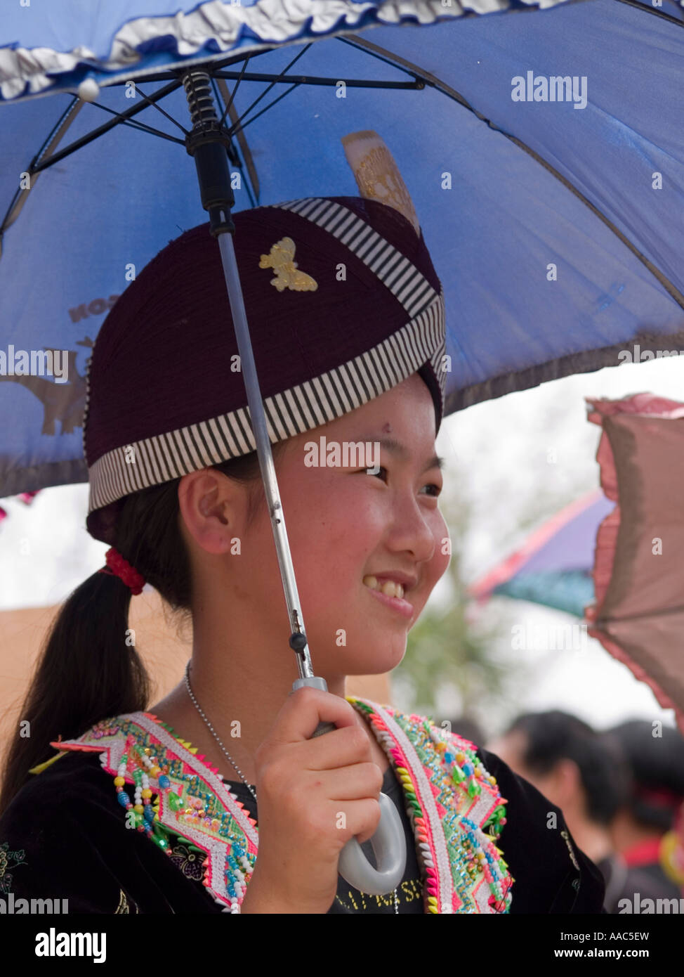 Hmong girl under umbrella Luang Prabang Laos Stock Photo - Alamy