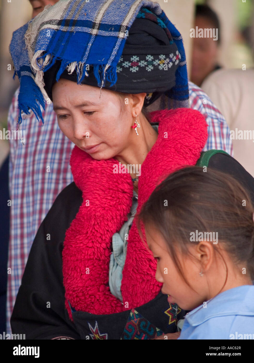 Yao woman with traditional turban and giant collar in the market with ...