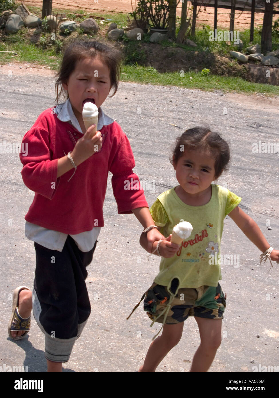 girls running with ice cream Muang Singh Laos Stock Photo - Alamy