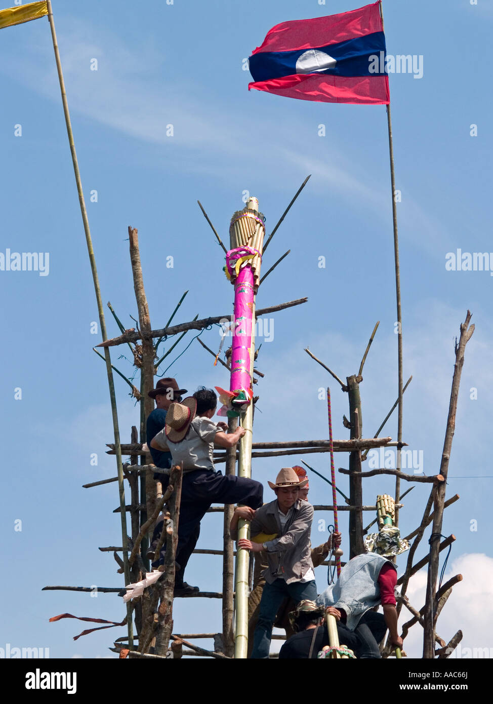 locals prepare a bamboo rocket for launching at the Bun Bang Fai Rocket ...