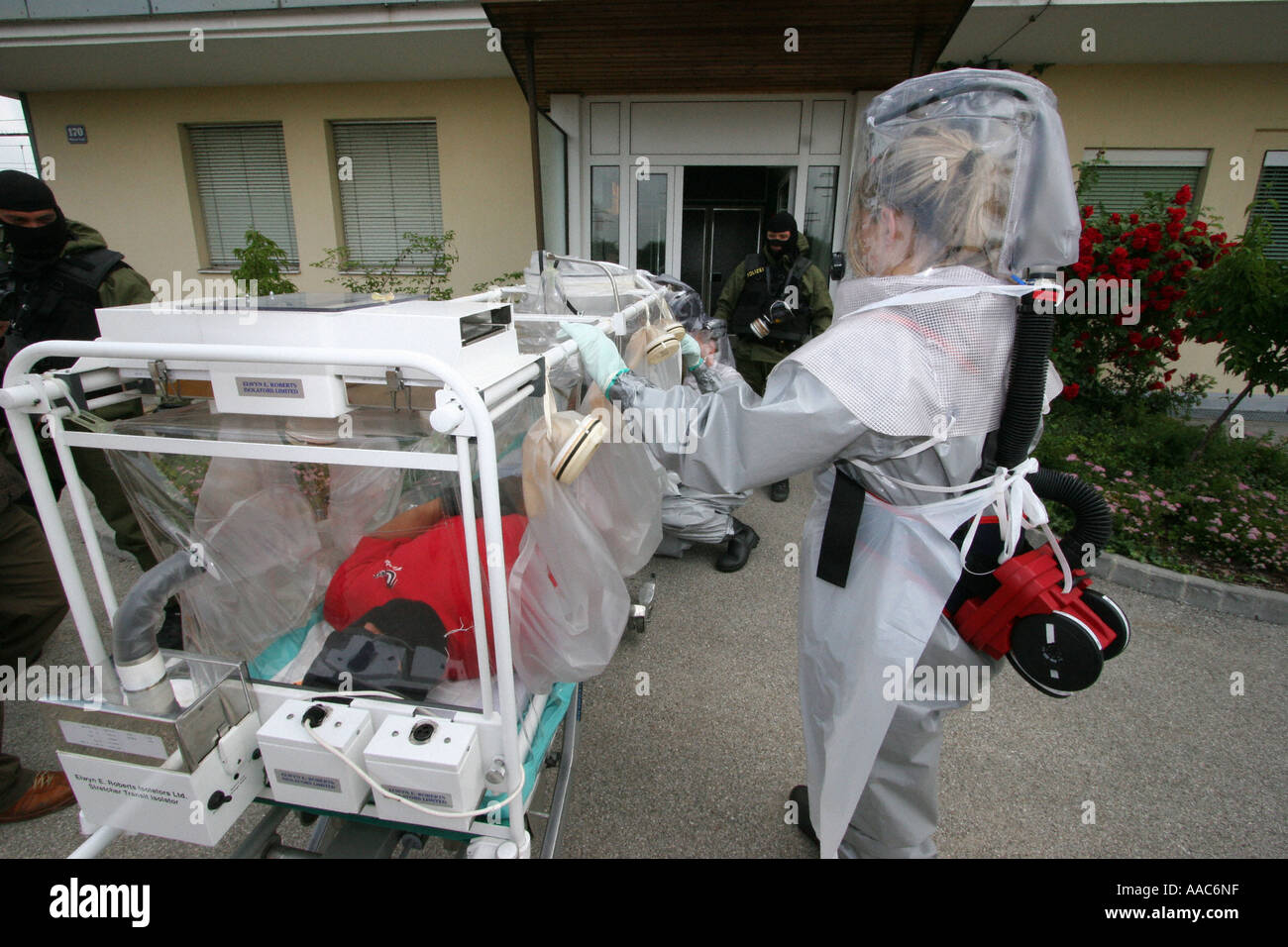 Austrian Red cross at mission, protective suit Stock Photo - Alamy