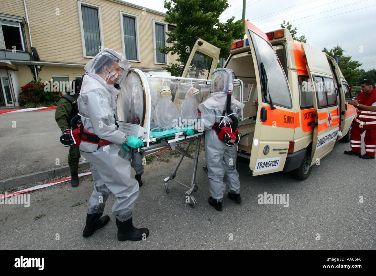 Austrian Red cross at mission, protective suit Stock Photo - Alamy