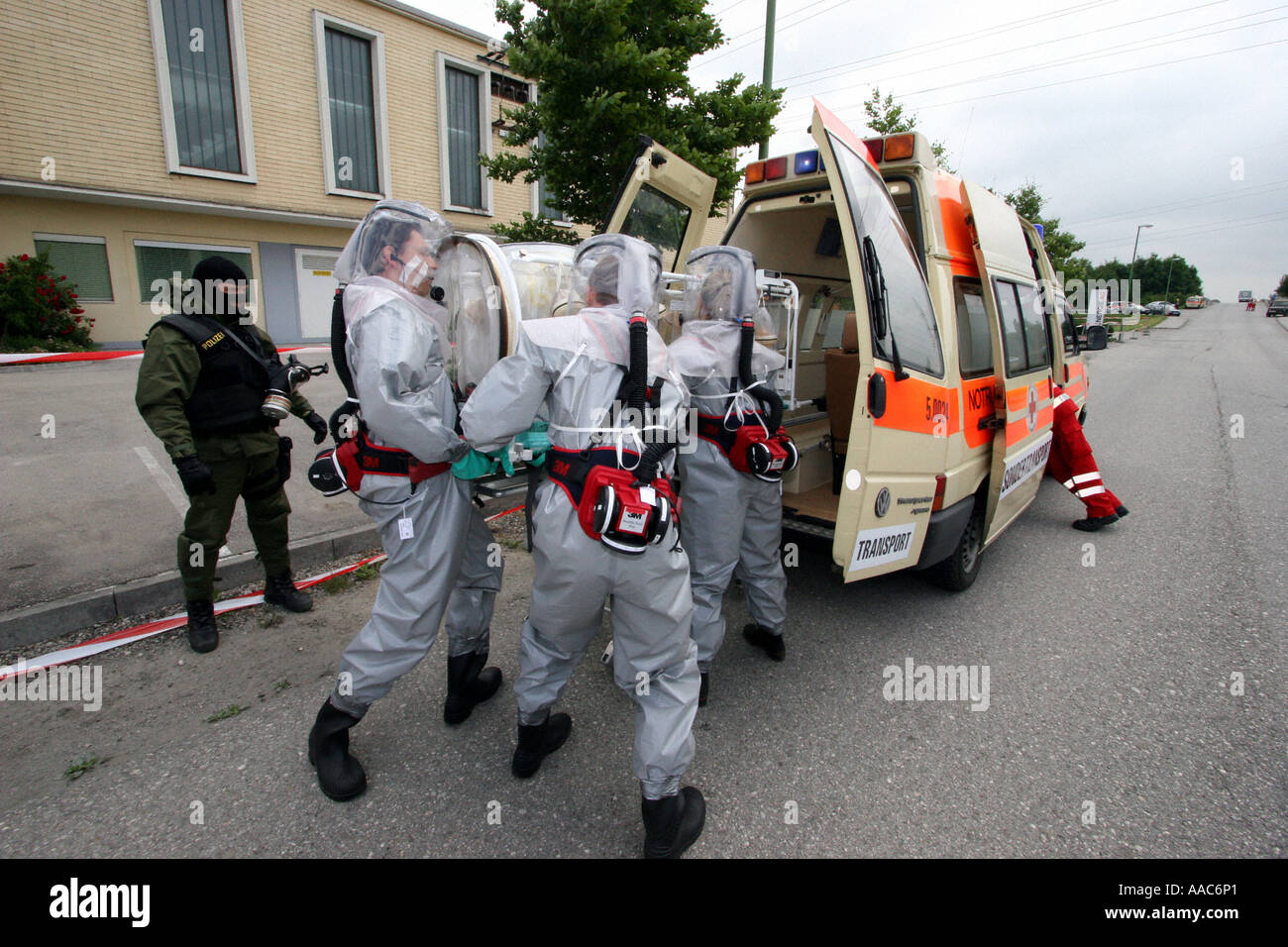 Austrian Red cross at mission, protective suit Stock Photo - Alamy