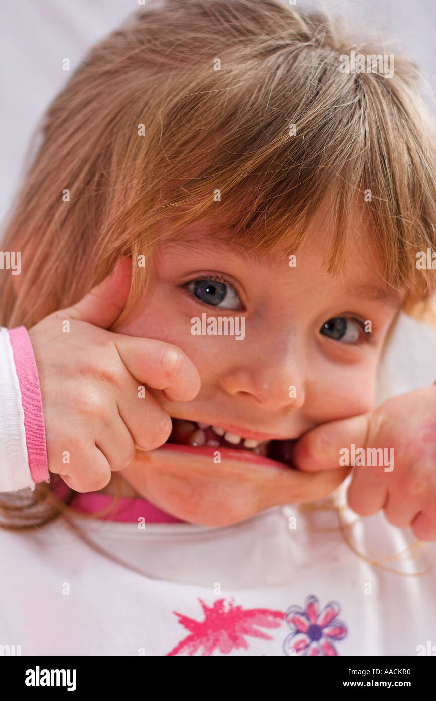 Child pulling a face Stock Photo - Alamy