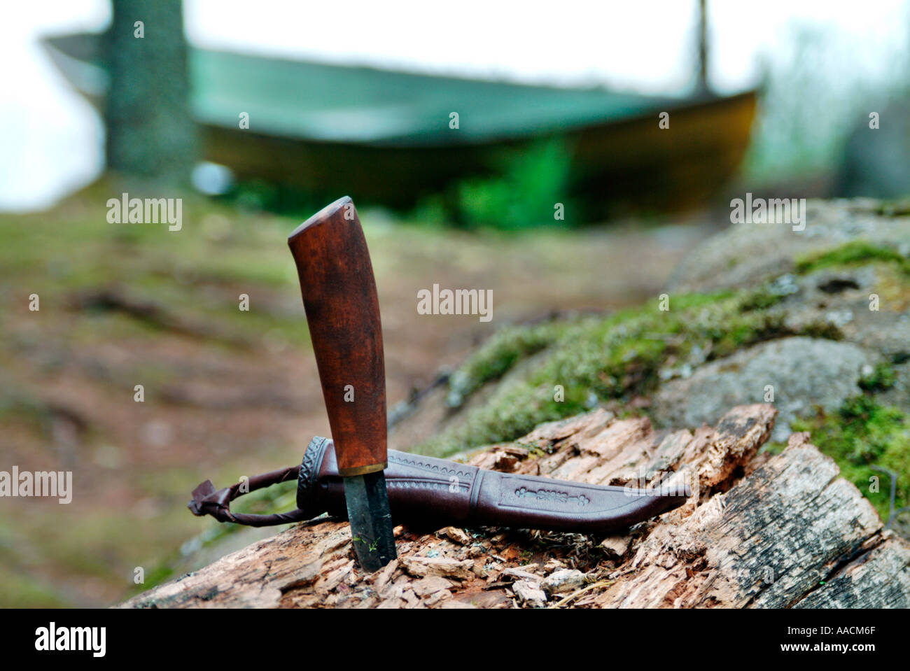 traditional knife from Finland on the lakefront Stock Photo - Alamy