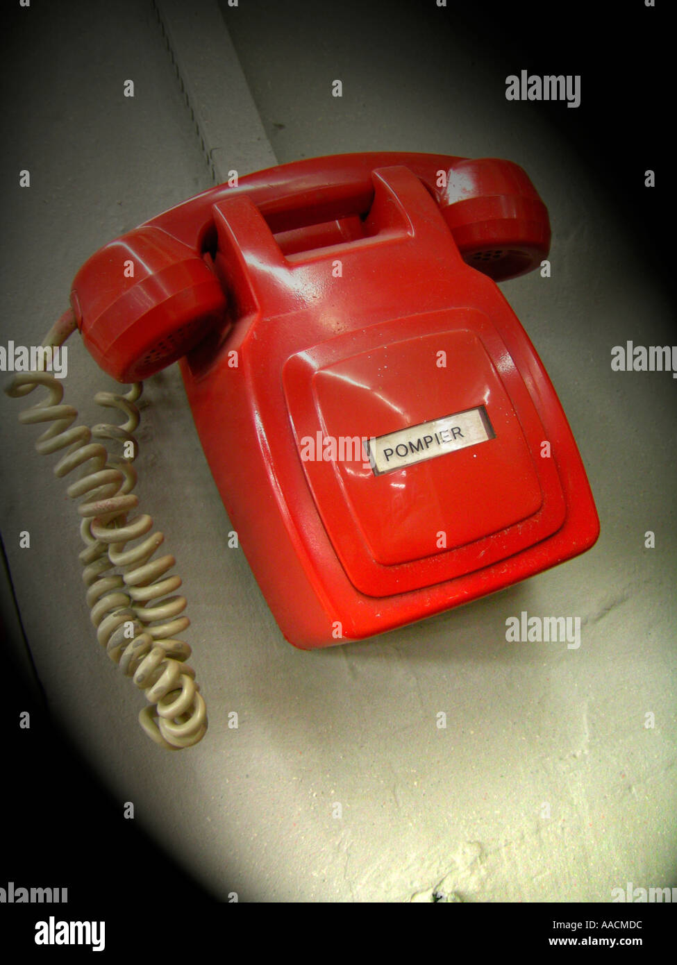 red emergency telephone for fire brigade hanging on a wall Stock Photo ...