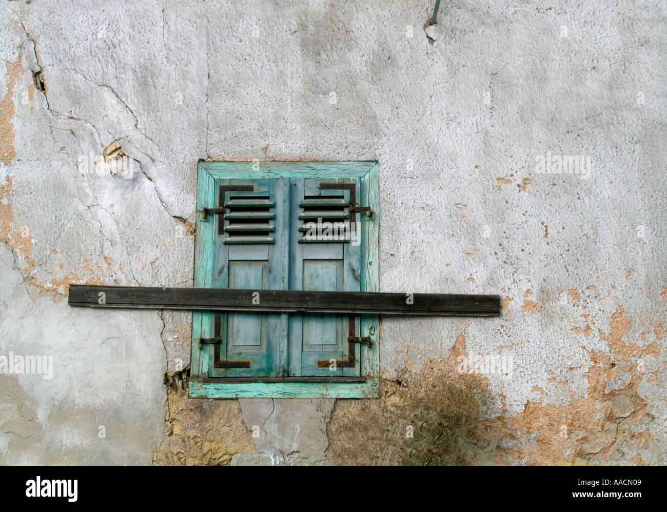 with latch closed window of a vacated house Stock Photo - Alamy