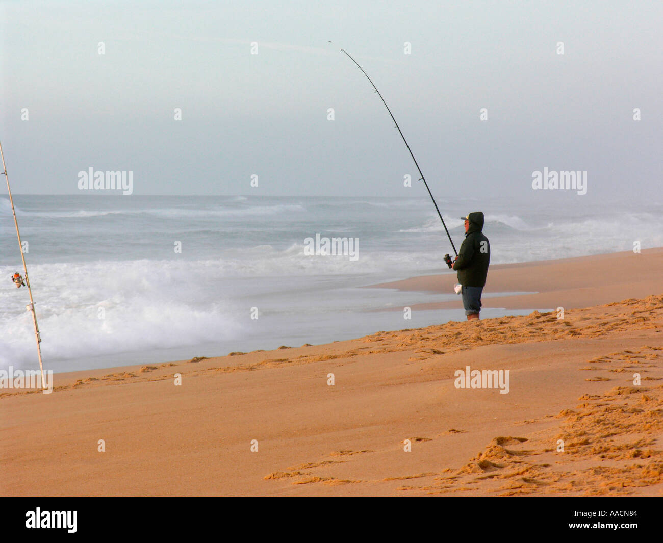 angler at the beach of Atlantic ocean in France Stock Photo - Alamy