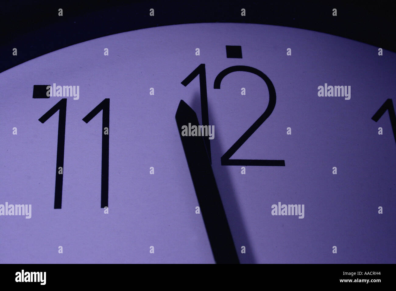 Symbol 1 minute before 12 Stock Photo - Alamy