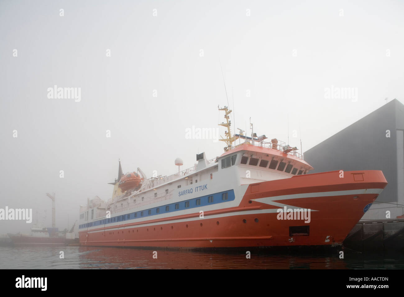 Greenland Ilulissat Fog shrouds Arctic Umiaq Line ferry docked at citys ...
