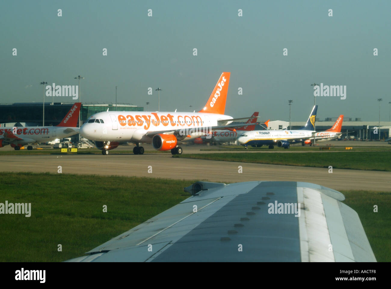 View from inside passenger jet aircraft about to take off showing wing ...