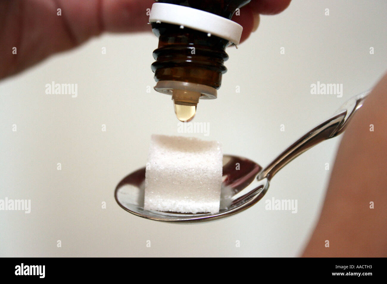 Medicine dripping on sugar Stock Photo - Alamy