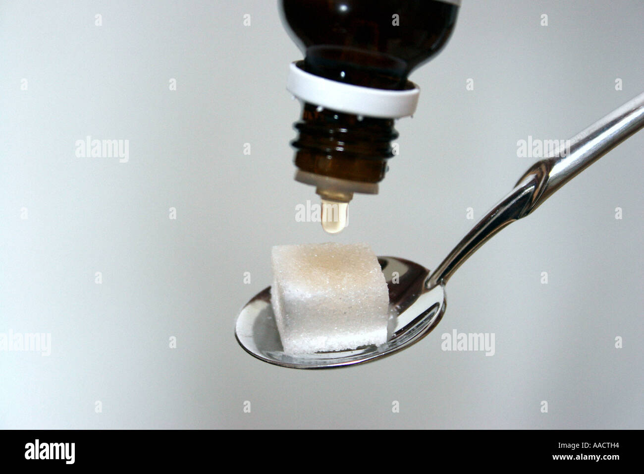Medicine dripping on sugar Stock Photo - Alamy