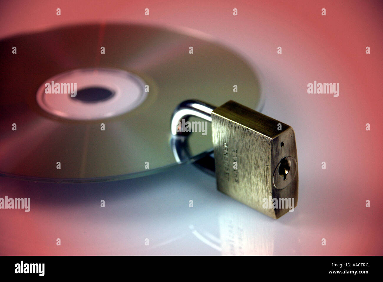Symbol data security, CD ROM with lock Stock Photo - Alamy