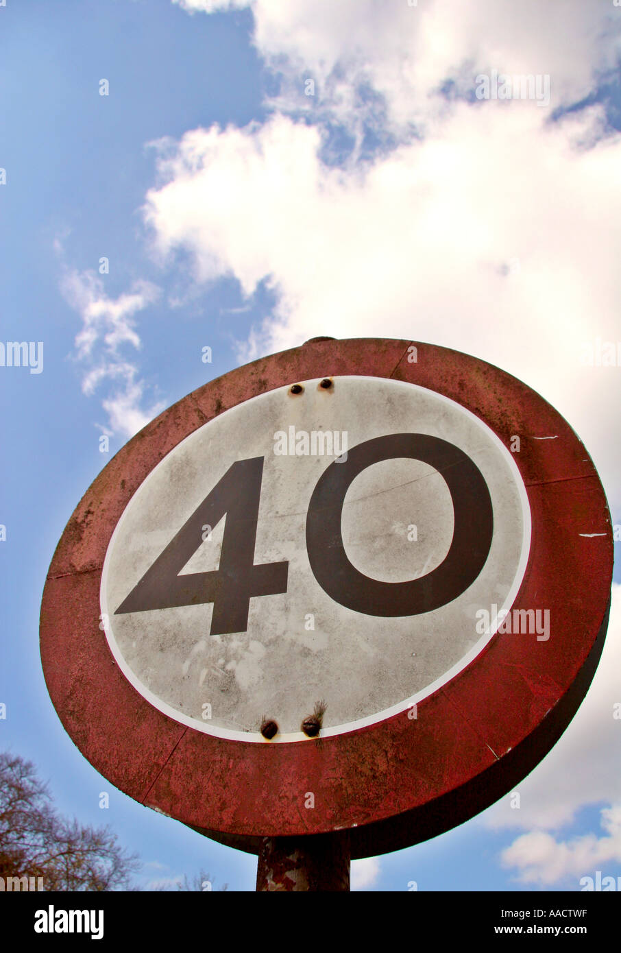 old maximum speed sign contrasting urban and nature Stock Photo - Alamy