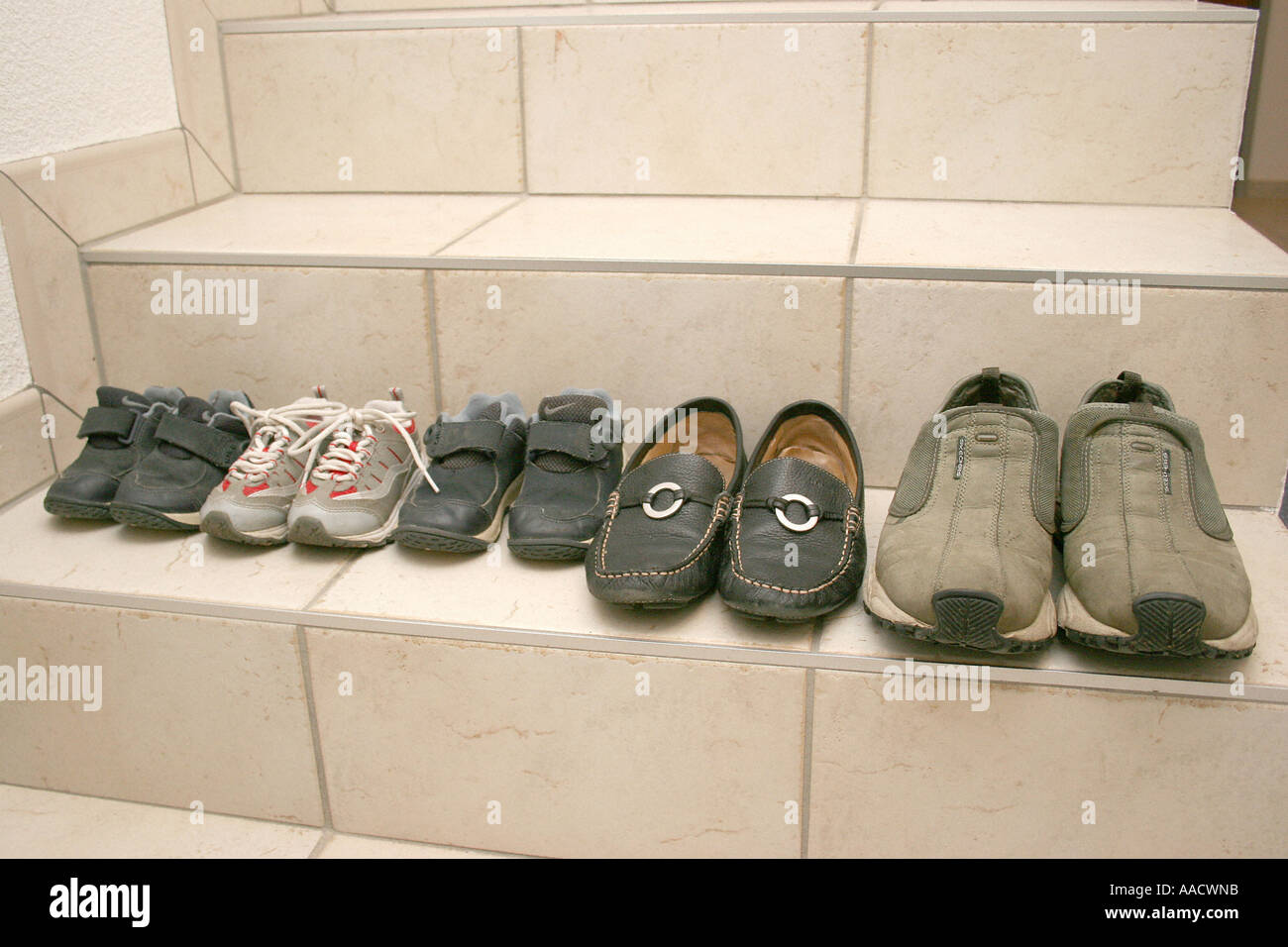 Shoes of a family Stock Photo - Alamy