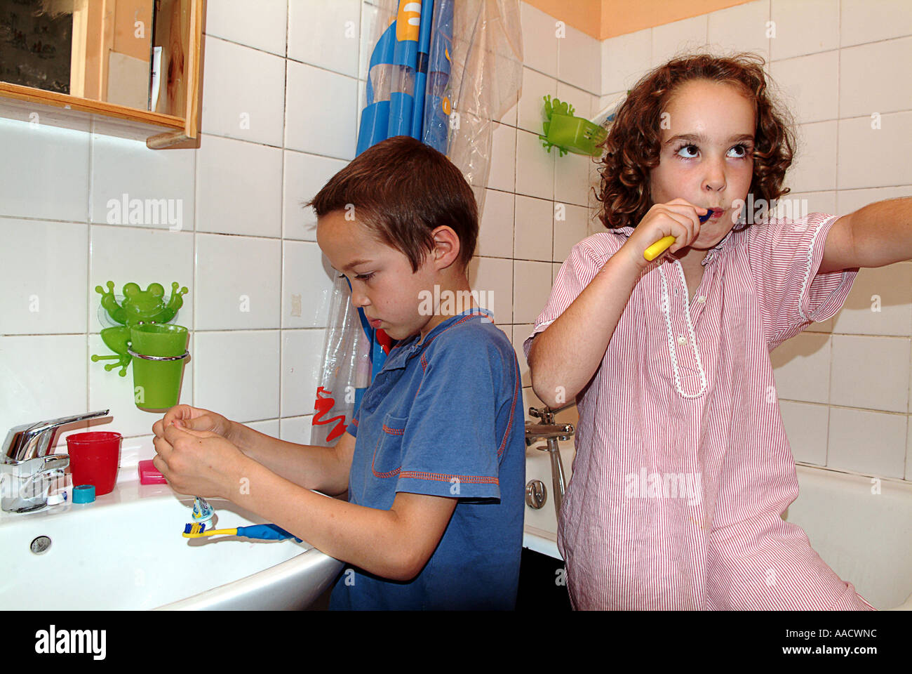 Timotee and Camille are brushing their teeth Stock Photo - Alamy