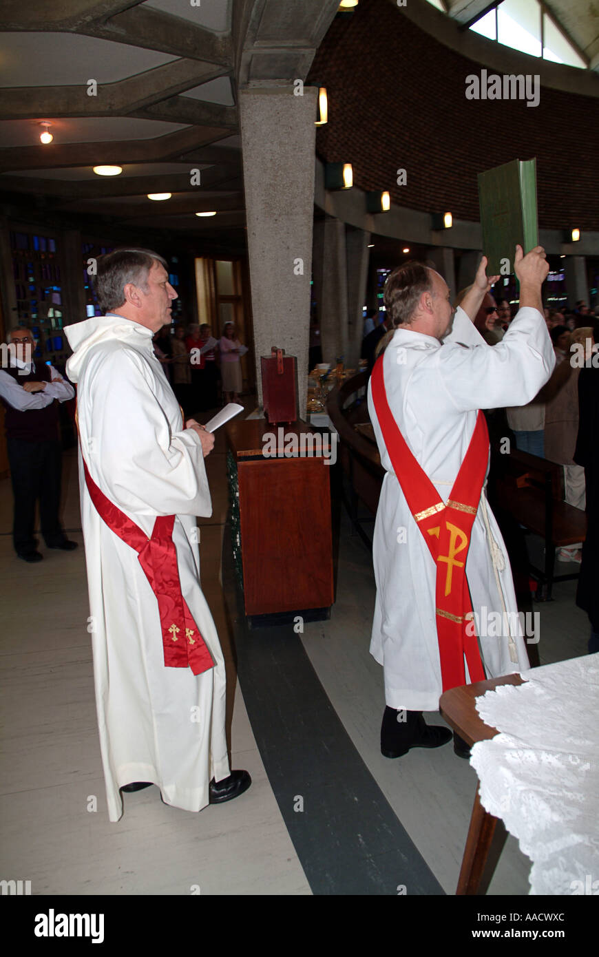 carrying the bible at the ordination of a catholic priest in St Mary's ...
