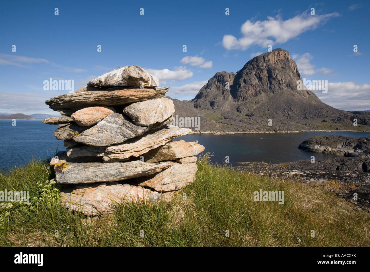 Greenland Sisimiut Holsteinsborg Afternoon sun lights rock carin left ...