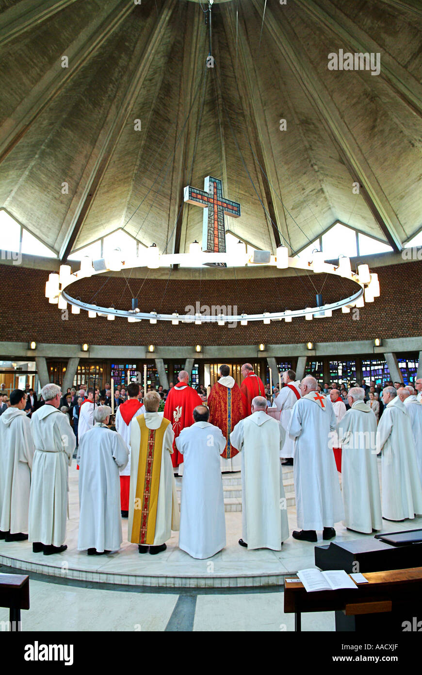 15 priests concelebrate during the ordination of a catholic priest in ...