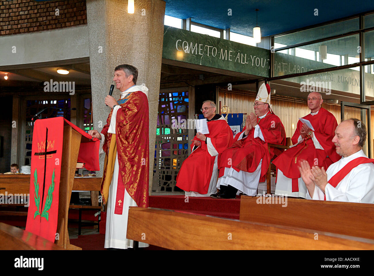 Newly ordained catholic priest thanking the congregation at the end of ...