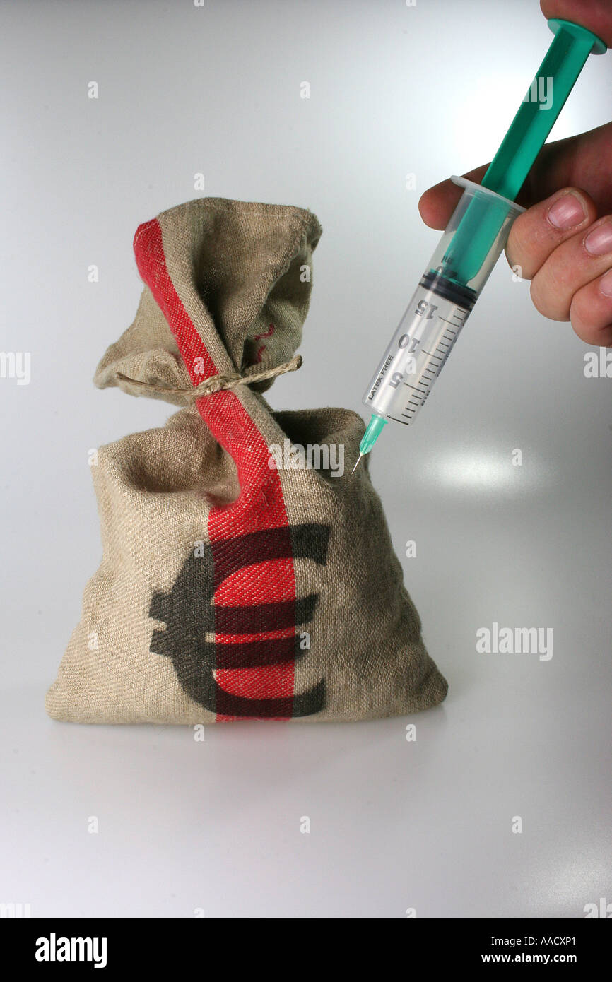 Symbol money syringe Stock Photo - Alamy