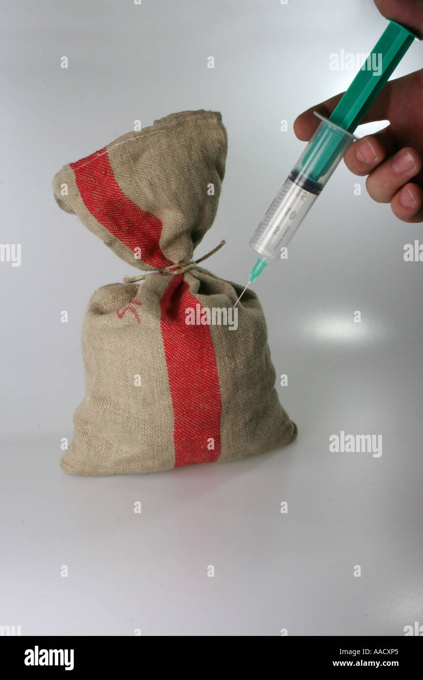 Symbol money syringe Stock Photo - Alamy