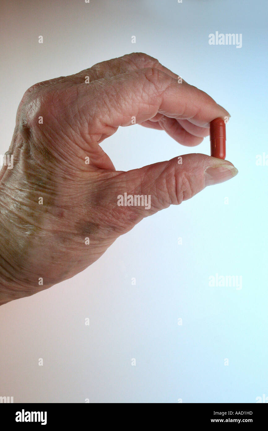 old womans hand with medicine Stock Photo - Alamy