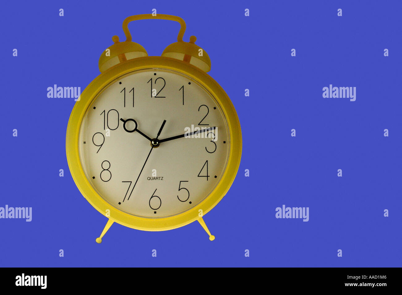 yellow alarm clock Stock Photo - Alamy