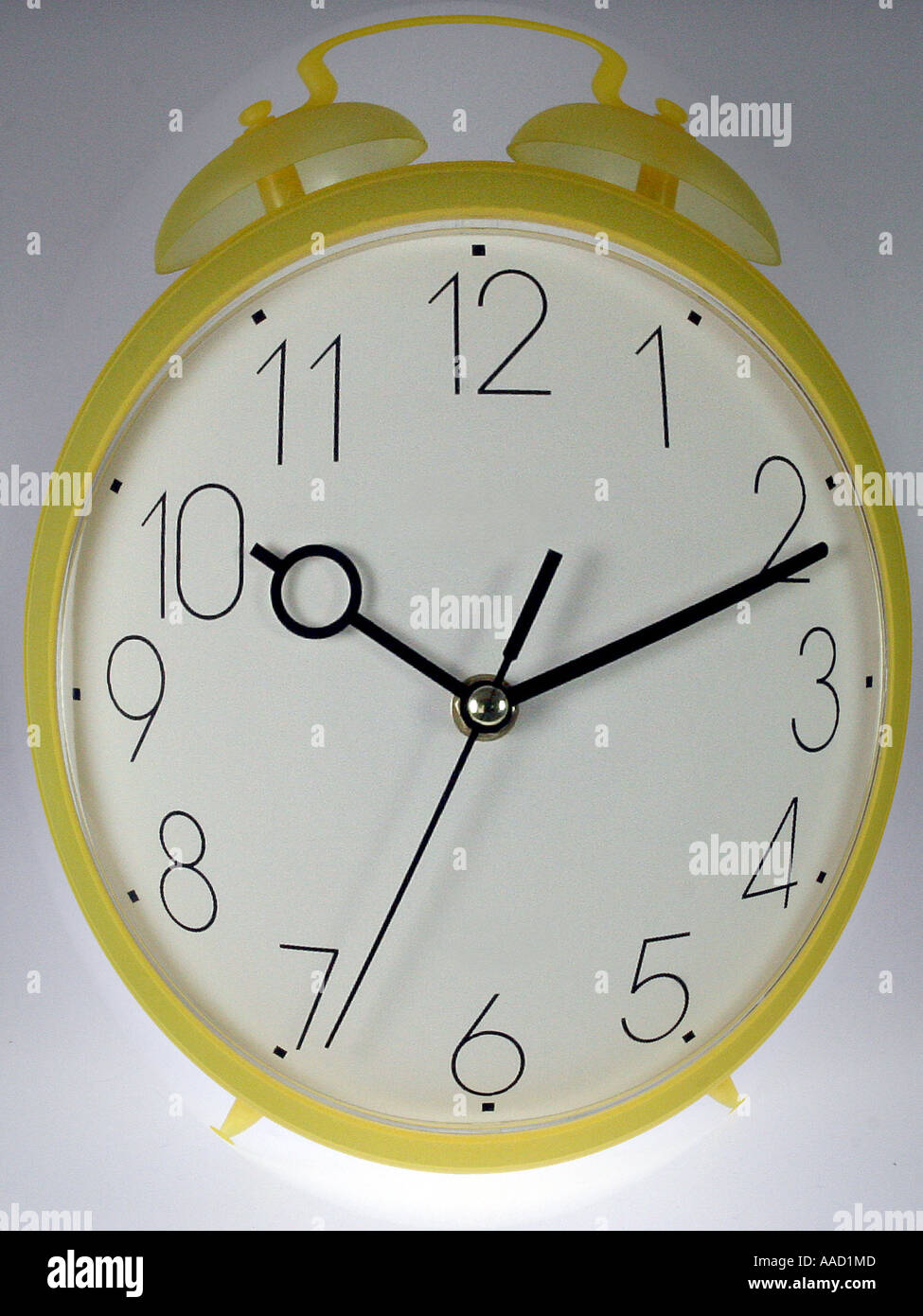 yellow alarm clock Stock Photo - Alamy