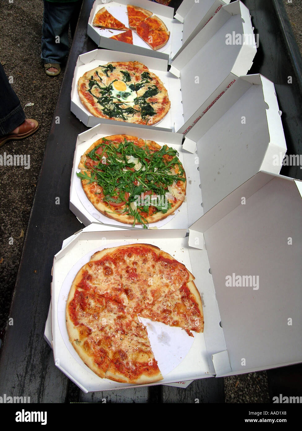 different pizzas in boxes Stock Photo - Alamy