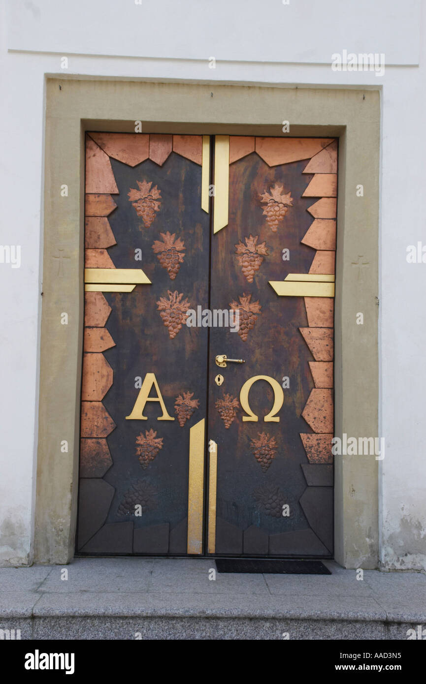 door to a curch with alqua and omega Stock Photo - Alamy