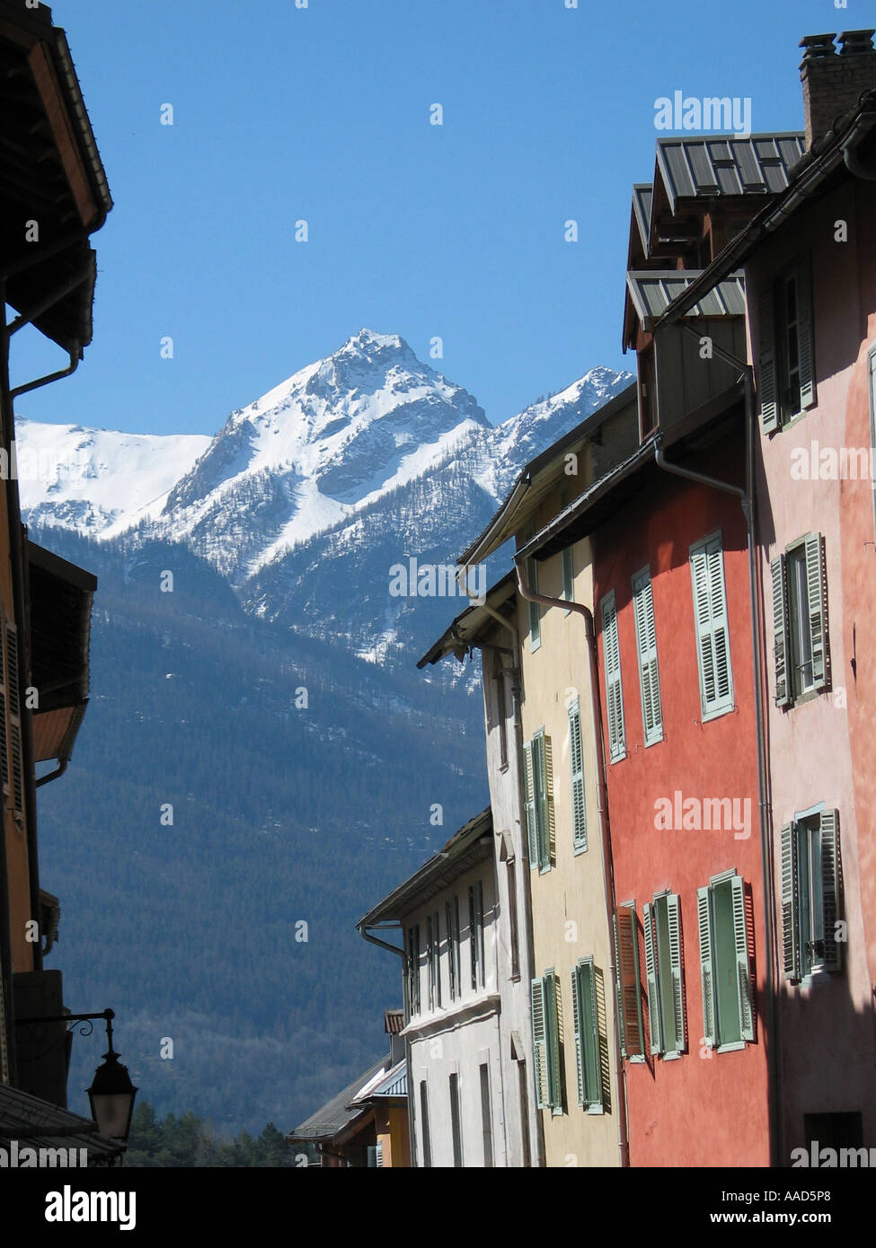 Main Street Old Town Briancon france with mountains Stock Photo - Alamy