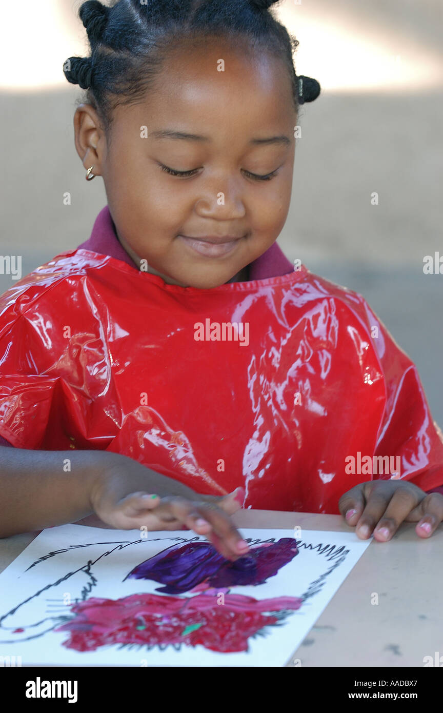 kindergarten student finger painting Stock Photo - Alamy