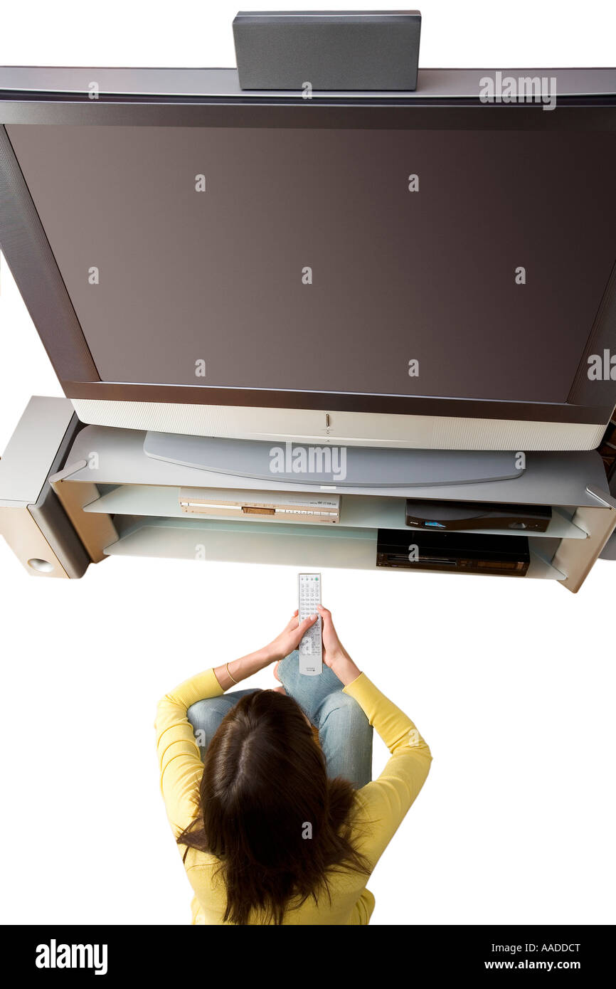Model Released Portrait of young woman watching large screen TV Stock ...