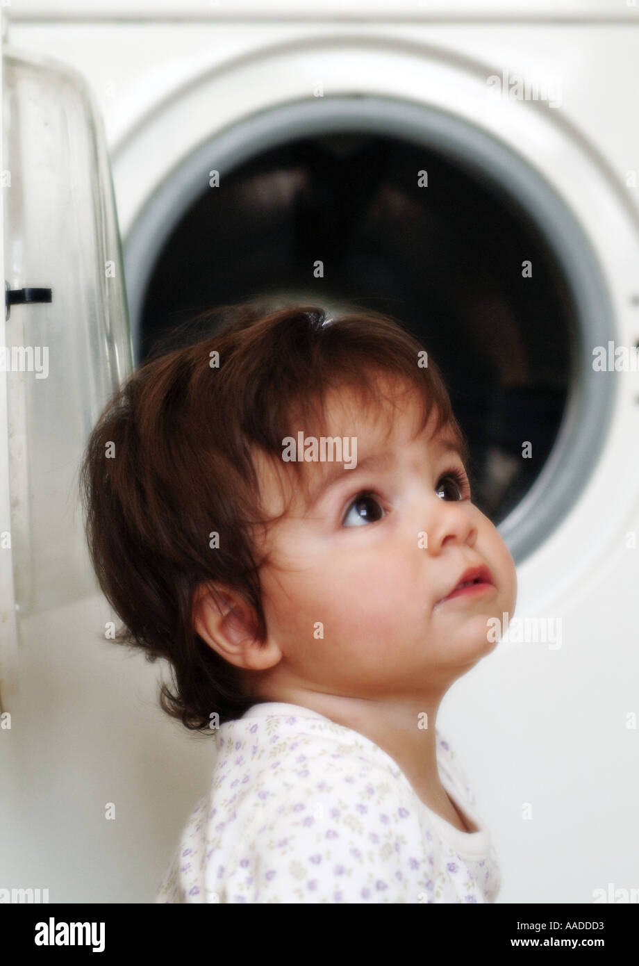 little girl around a washing machine Stock Photo - Alamy