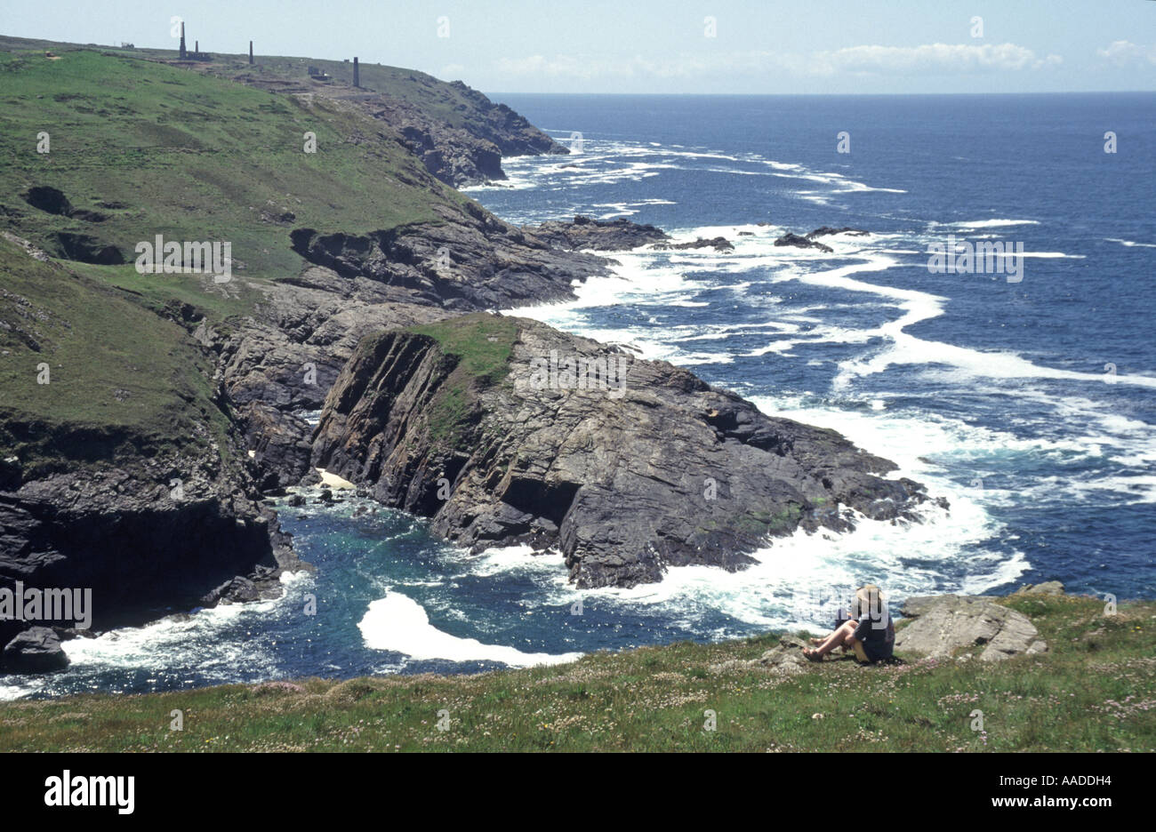 Rocky Cornish coastline landscape sea waves crash into shoreline rocks ...