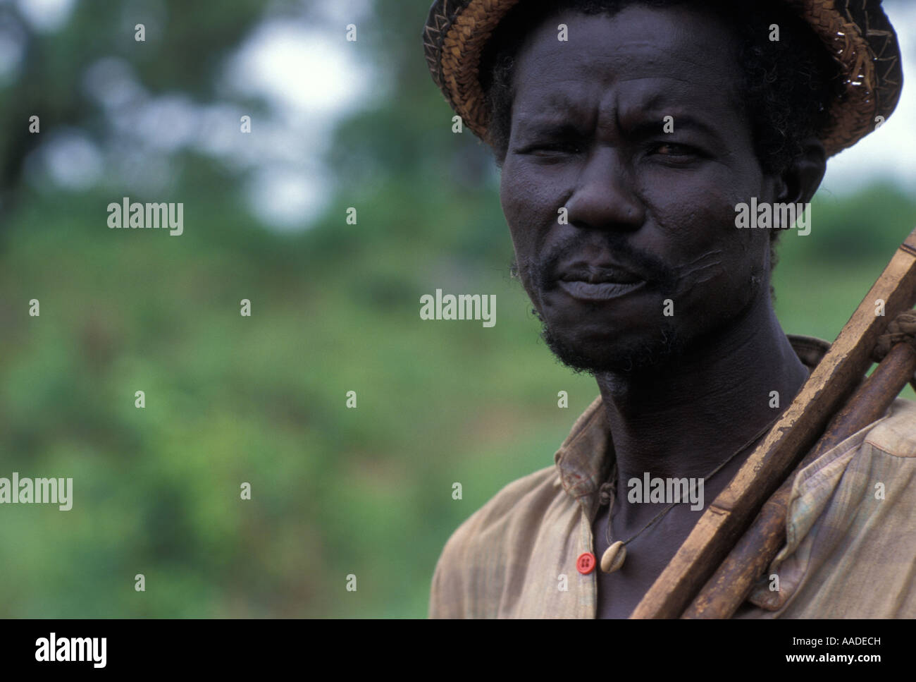 Dinka man with hunting tools at a Sudanese refugee camp near Asosa ...