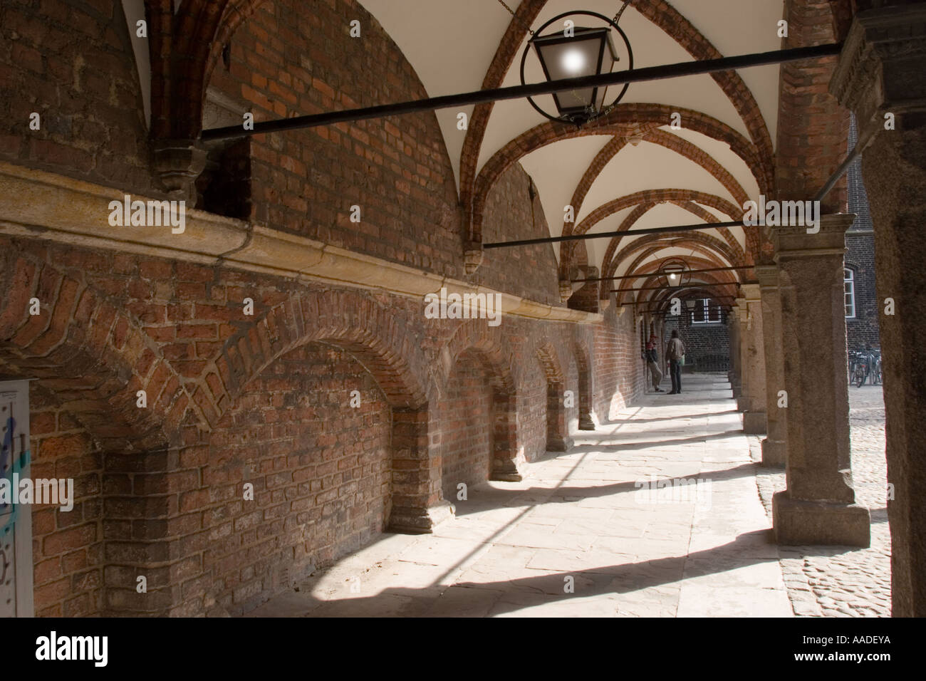 Covered cloisters walkway under the rathaus hi-res stock photography ...