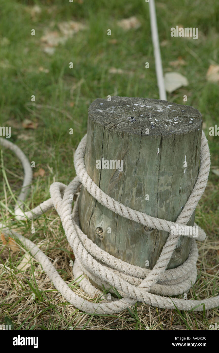 rope tied to mooring post on side of canal common in Europe and popular ...