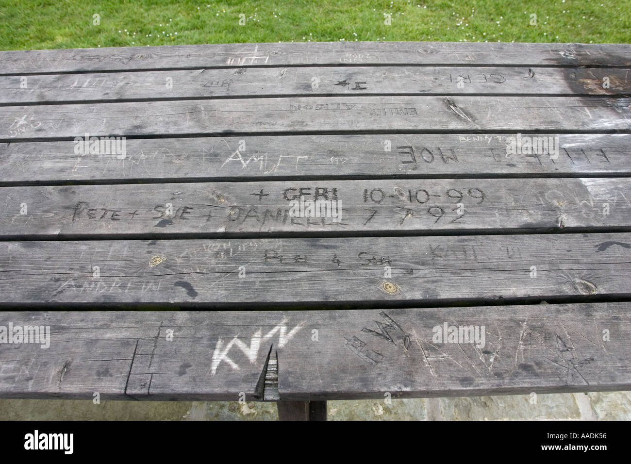 Initials carved on Forestry commission picnic table Scotland Stock ...