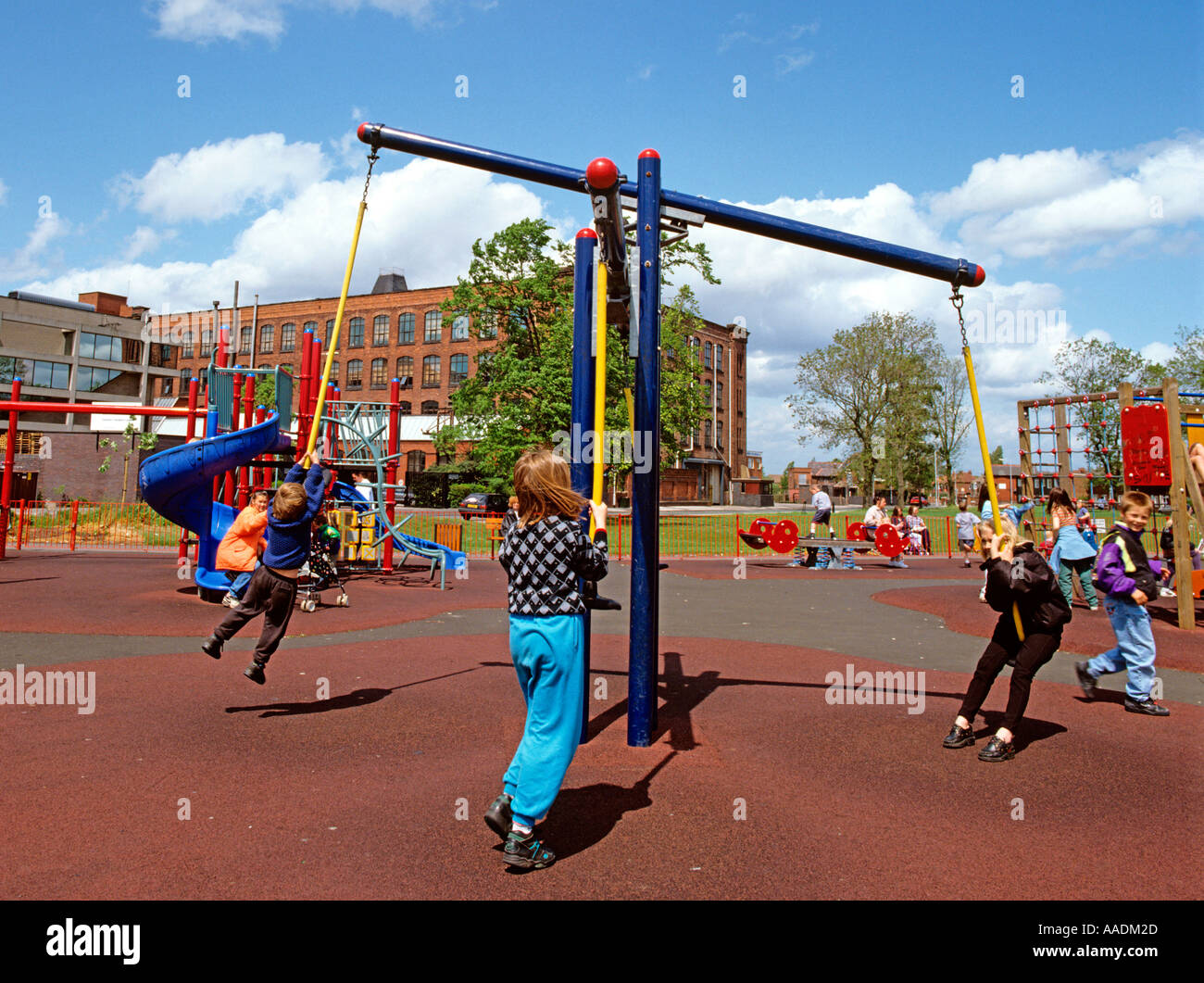 Cheshire Stockport children playing in urban play area Stock Photo - Alamy