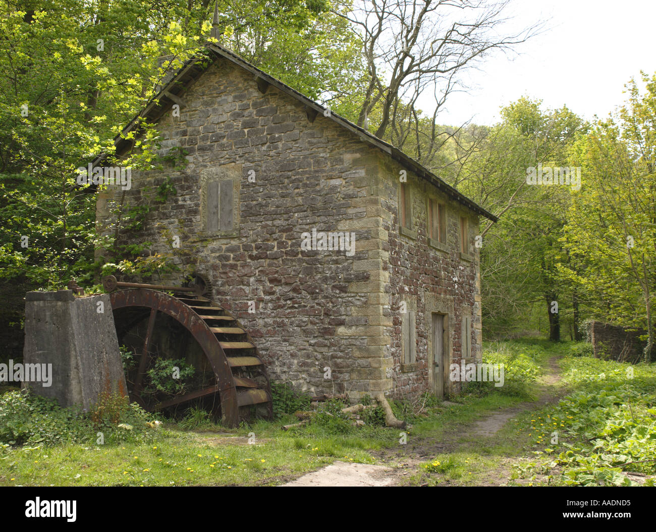 Restored water mill powered by the river Wye near Ashford in the Water ...